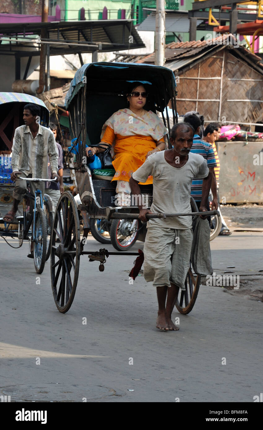 Hand pulled rickshaws waiting for customers at New Market Kolkata ...