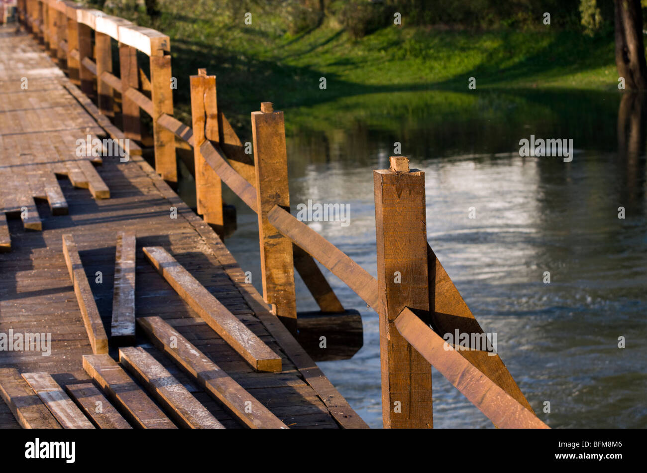 Construction of the wooden bridge over the river Stock Photo - Alamy