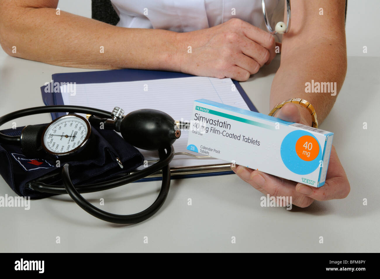 Doctor holding patients prescription drugs Stock Photo - Alamy