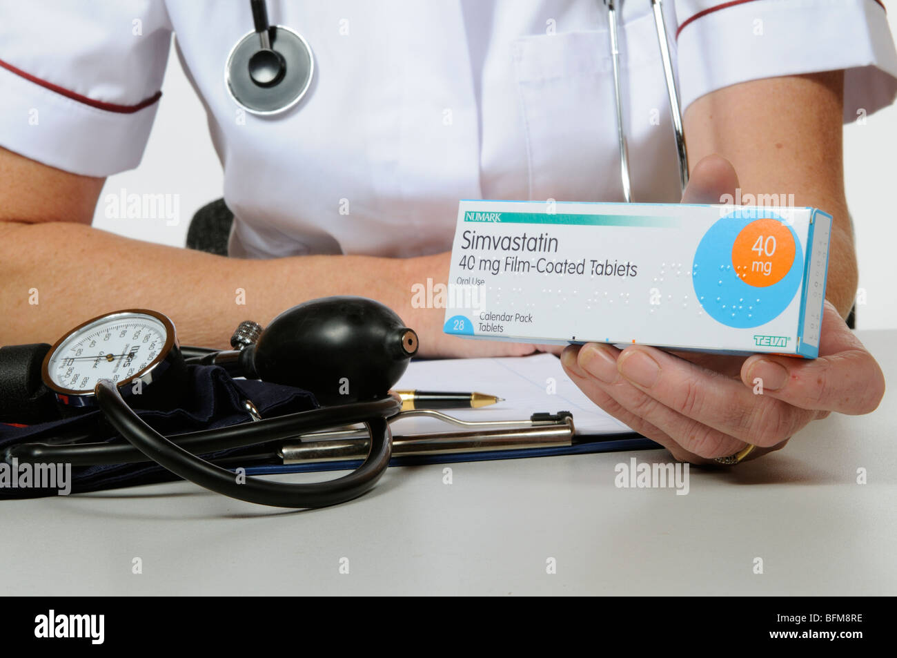 Doctor holding patients prescription drugs Stock Photo - Alamy