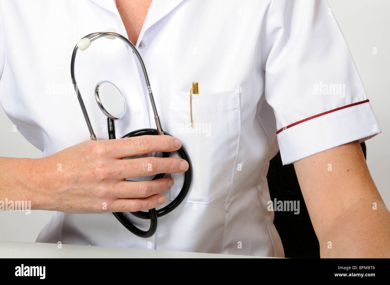 Stethoscope being held by a nurse Stock Photo - Alamy