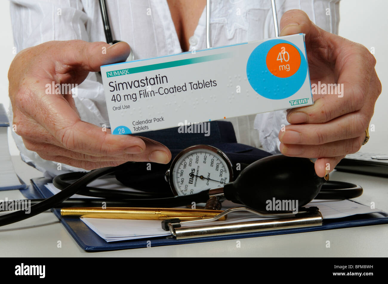 Doctor holding patients prescription drugs Stock Photo - Alamy