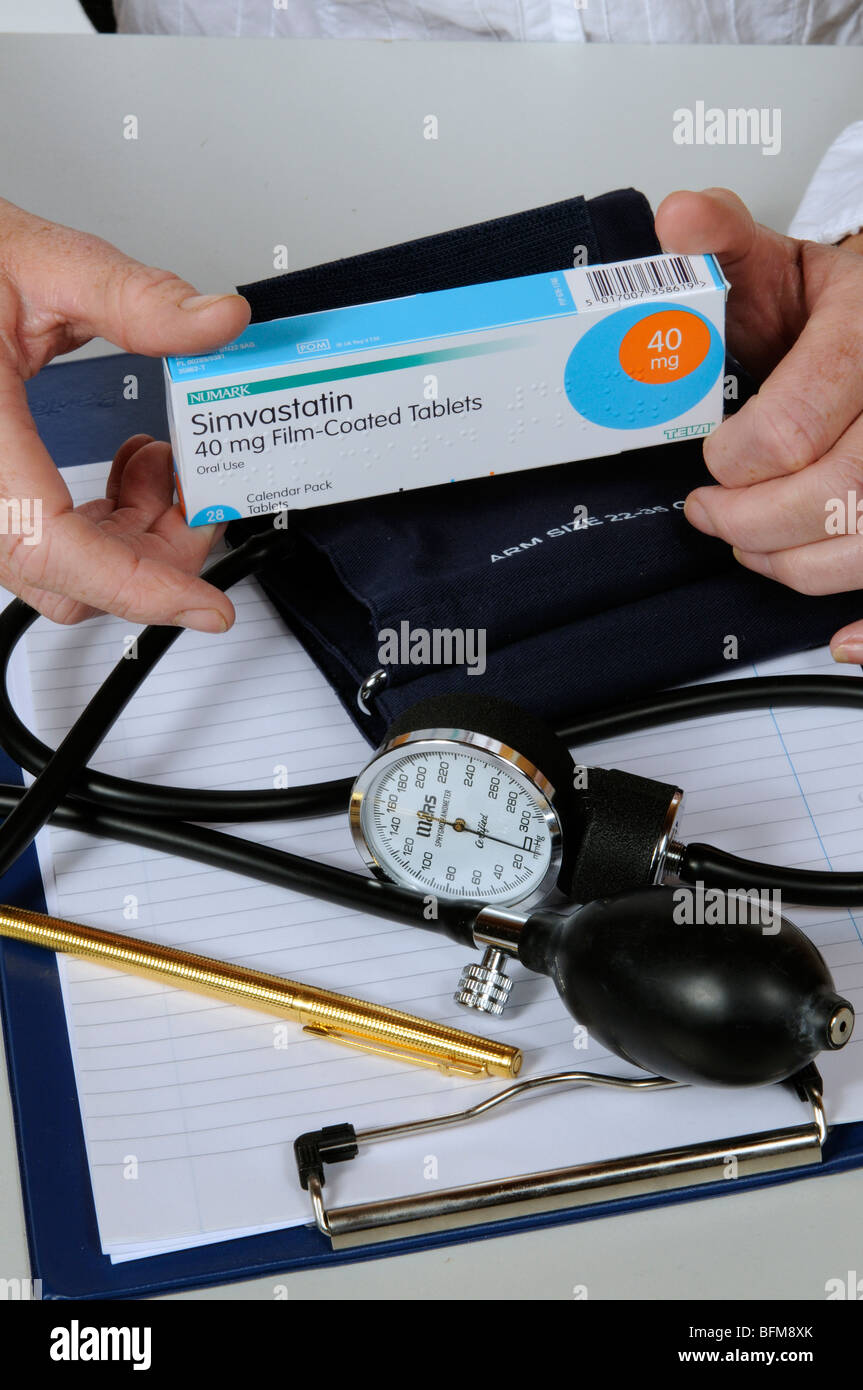 Doctor holding patients prescription drugs Stock Photo - Alamy
