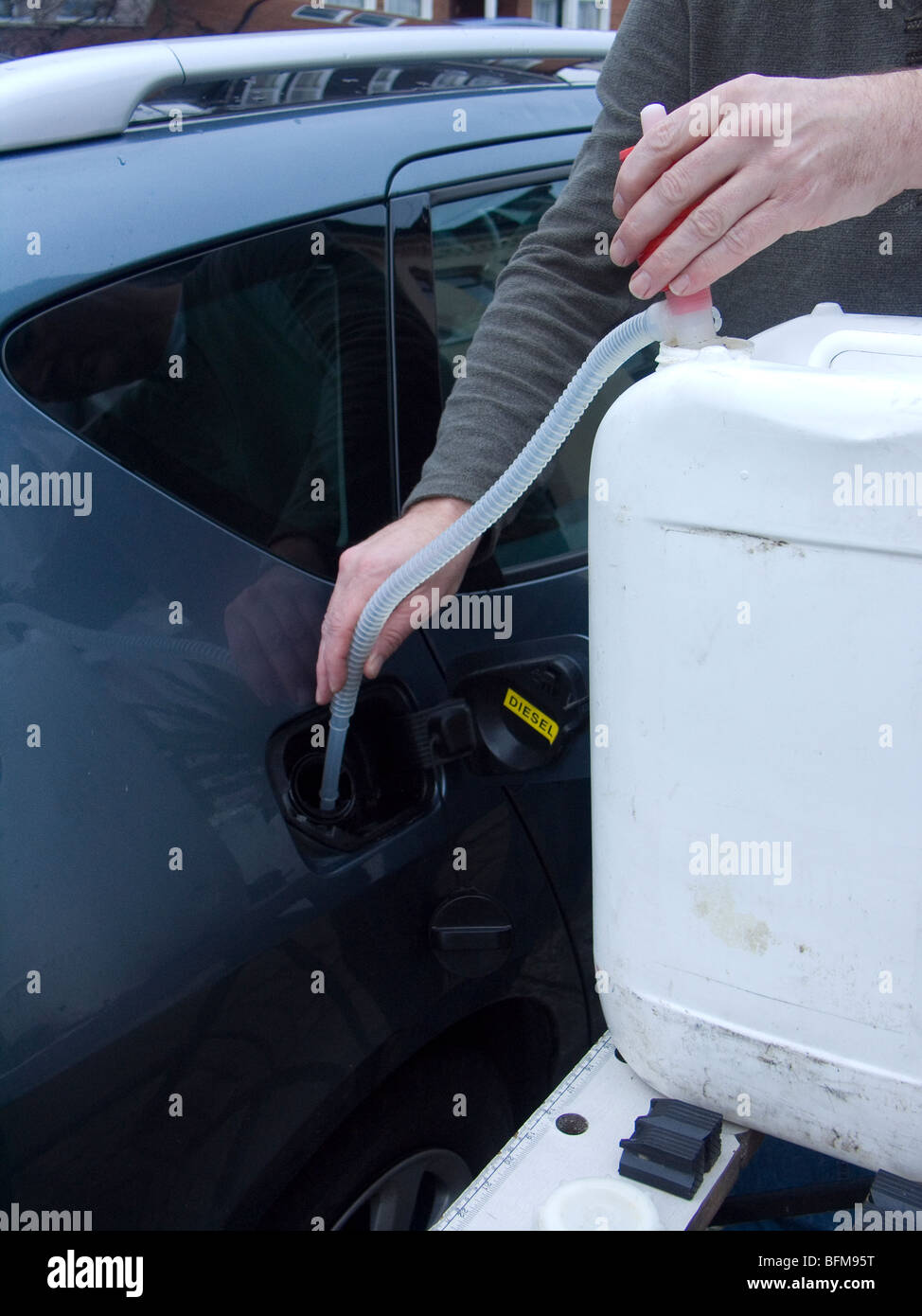 Pouring fuel hi-res stock photography and images - Alamy