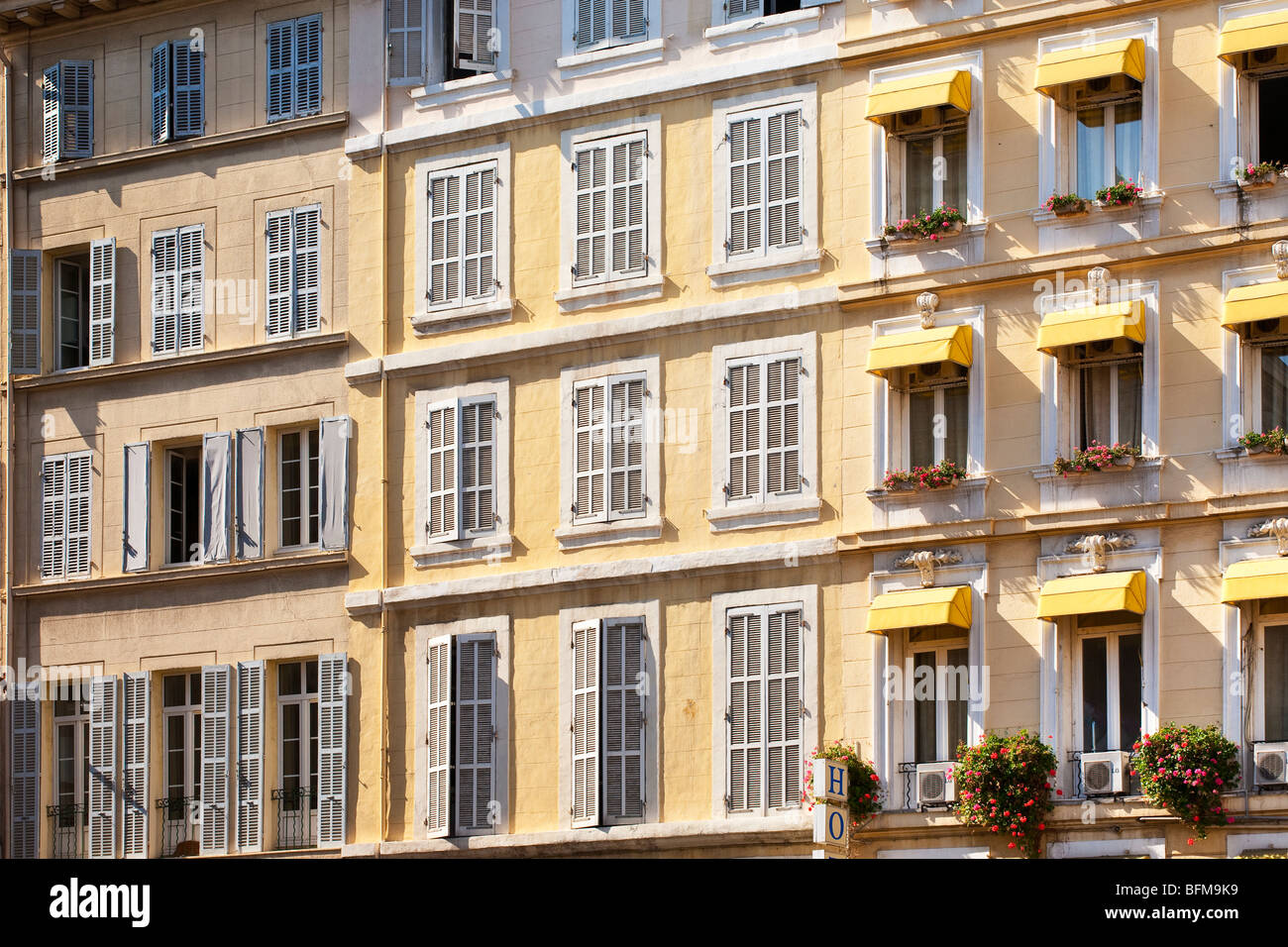 Facade of Provencal building with shuttered windows, Marseille, France ...