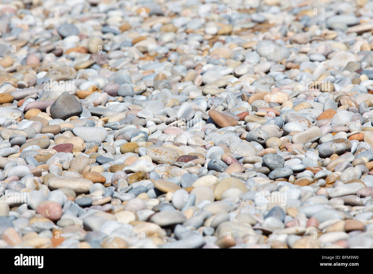Beach small stones background, full frame Stock Photo - Alamy