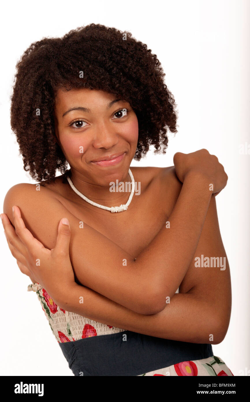 young african woman giving a knowing look whilst giving herself a hug ... young african woman giving a knowing look whilst giving herself a hug ...