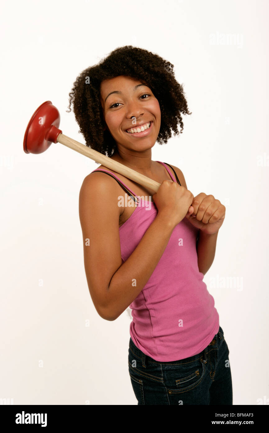 young woman holding a sink plunger apprentice worker or student ...
