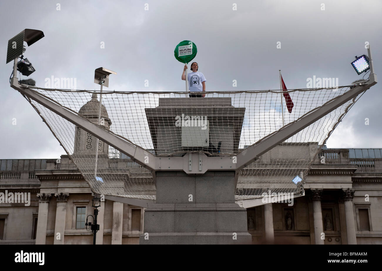 A man holding a banner as part of Antony Gormley's Fourth Plinth Project, London Stock Photo - Alamy