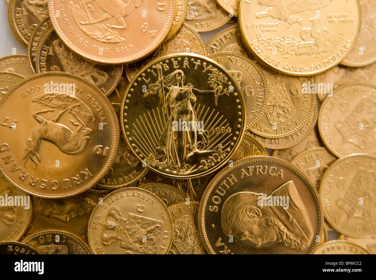 American Eagle, South African Krugerrand and Dutch Guilder gold coins ...