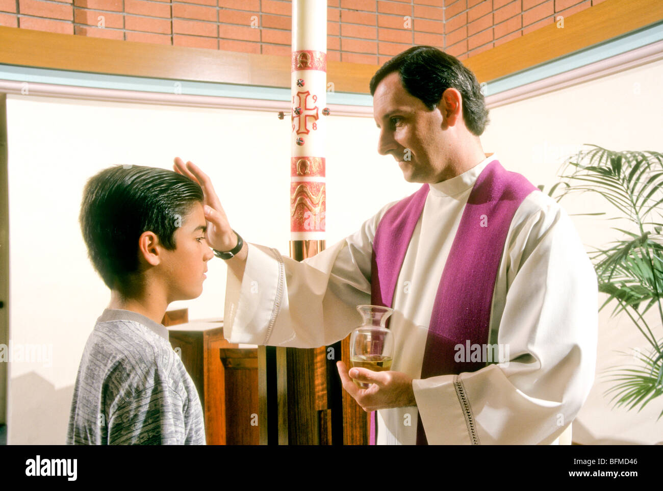 bless holy oil confirmation Stock Photo - Alamy