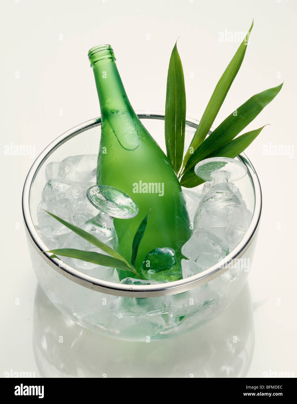 Bottle of Sake in ice bucket, white background Stock Photo - Alamy