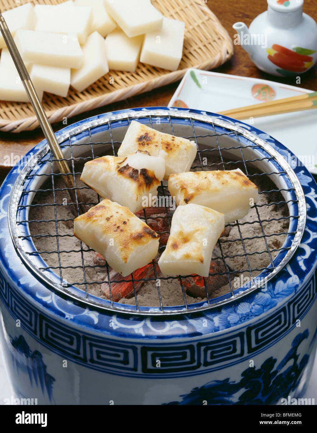 Grilled mochi over charcoal fire Stock Photo - Alamy