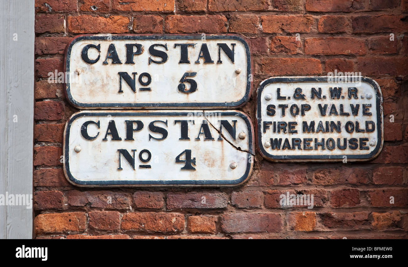 Signs attached to wall hi-res stock photography and images - Alamy