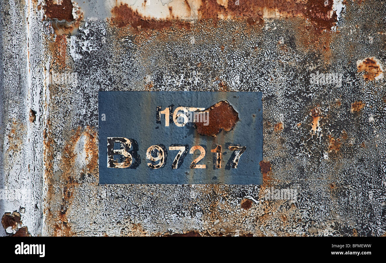 Worn sign "167 B97217" attached to decaying textured wall Stock Photo ...