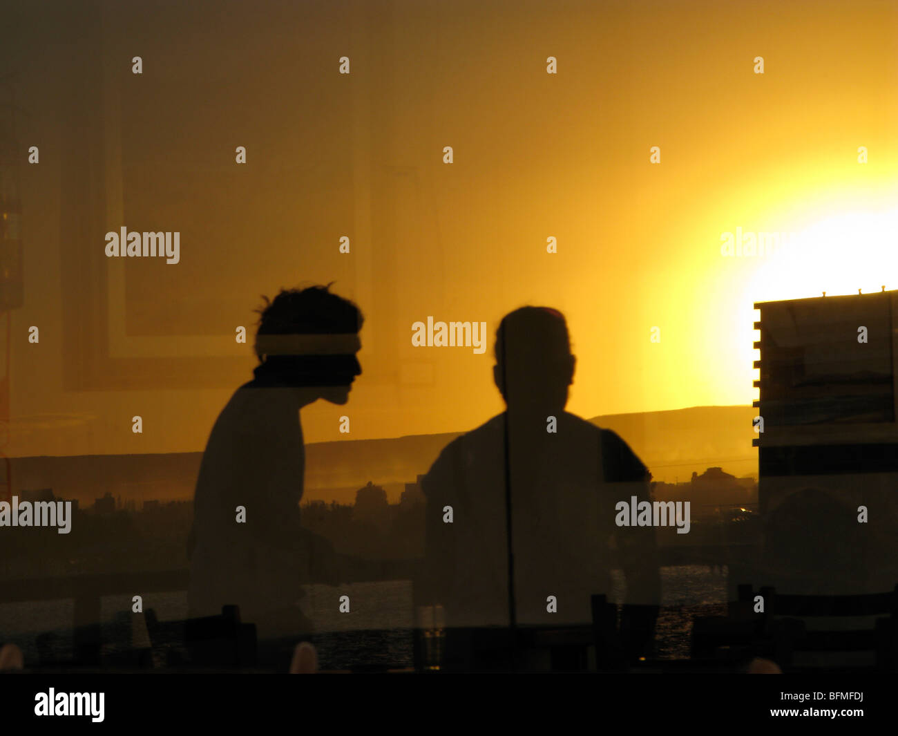 people reflected in a window, at sunset Stock Photo - Alamy