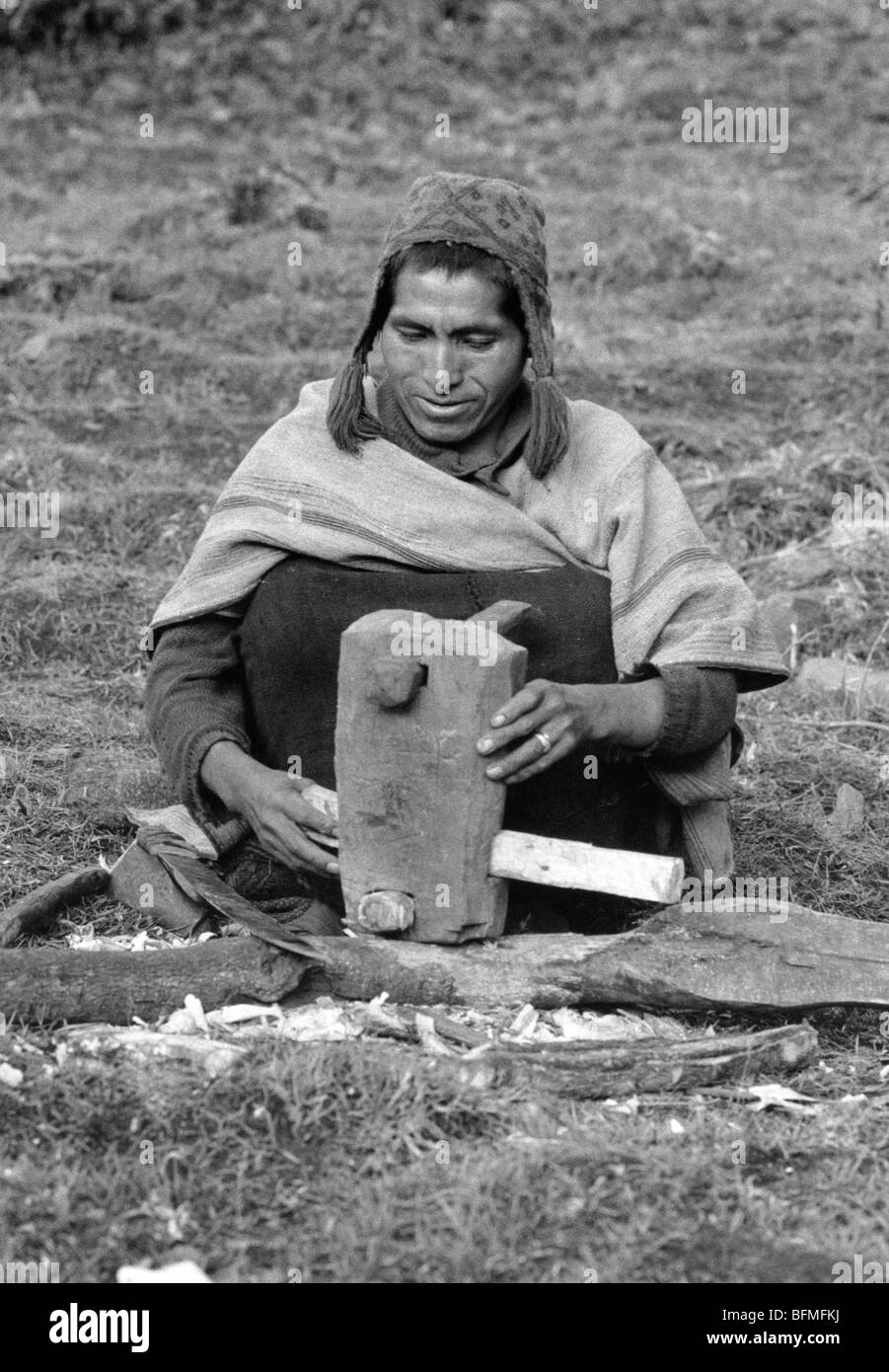 Qeros Native Quechua Indians making a traditional wooden lock to be ...