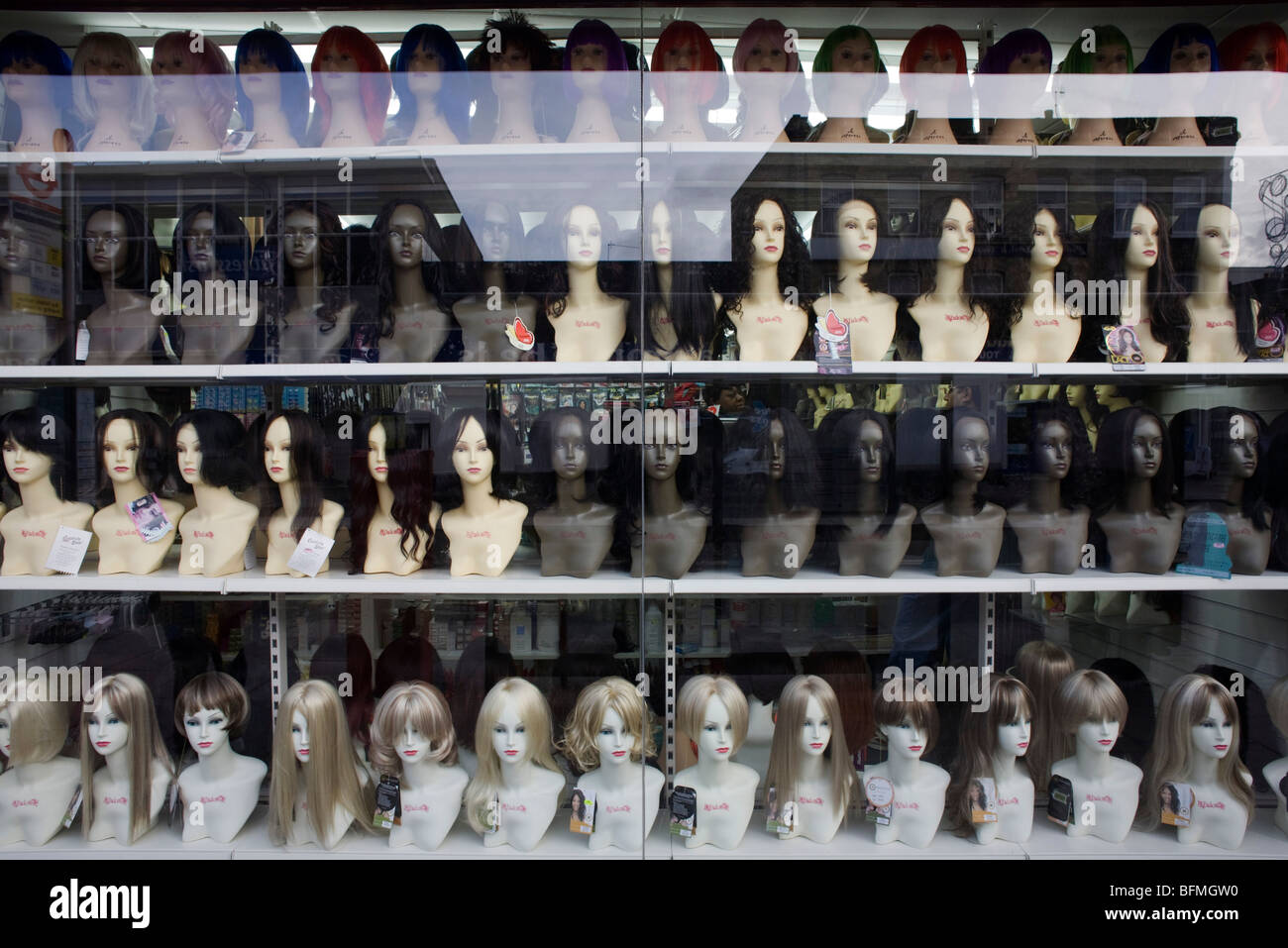 Variety of skin colours and ethnicity on wig model heads in high-street ...
