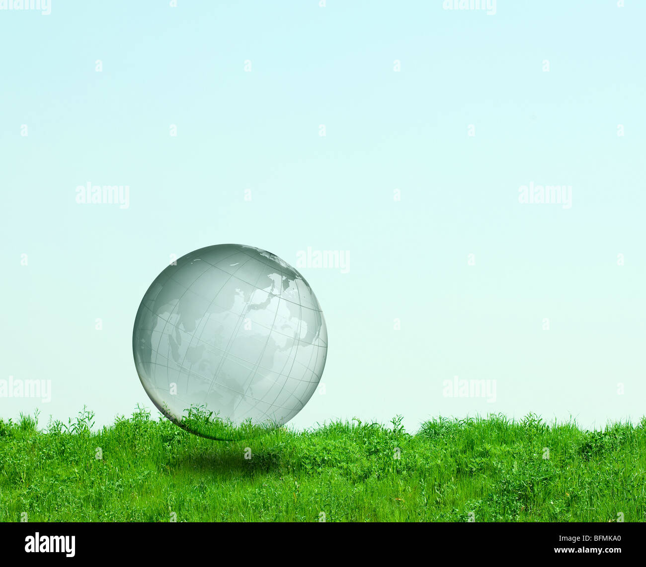 Clear Globe Floating Above Green Field Stock Photo - Alamy
