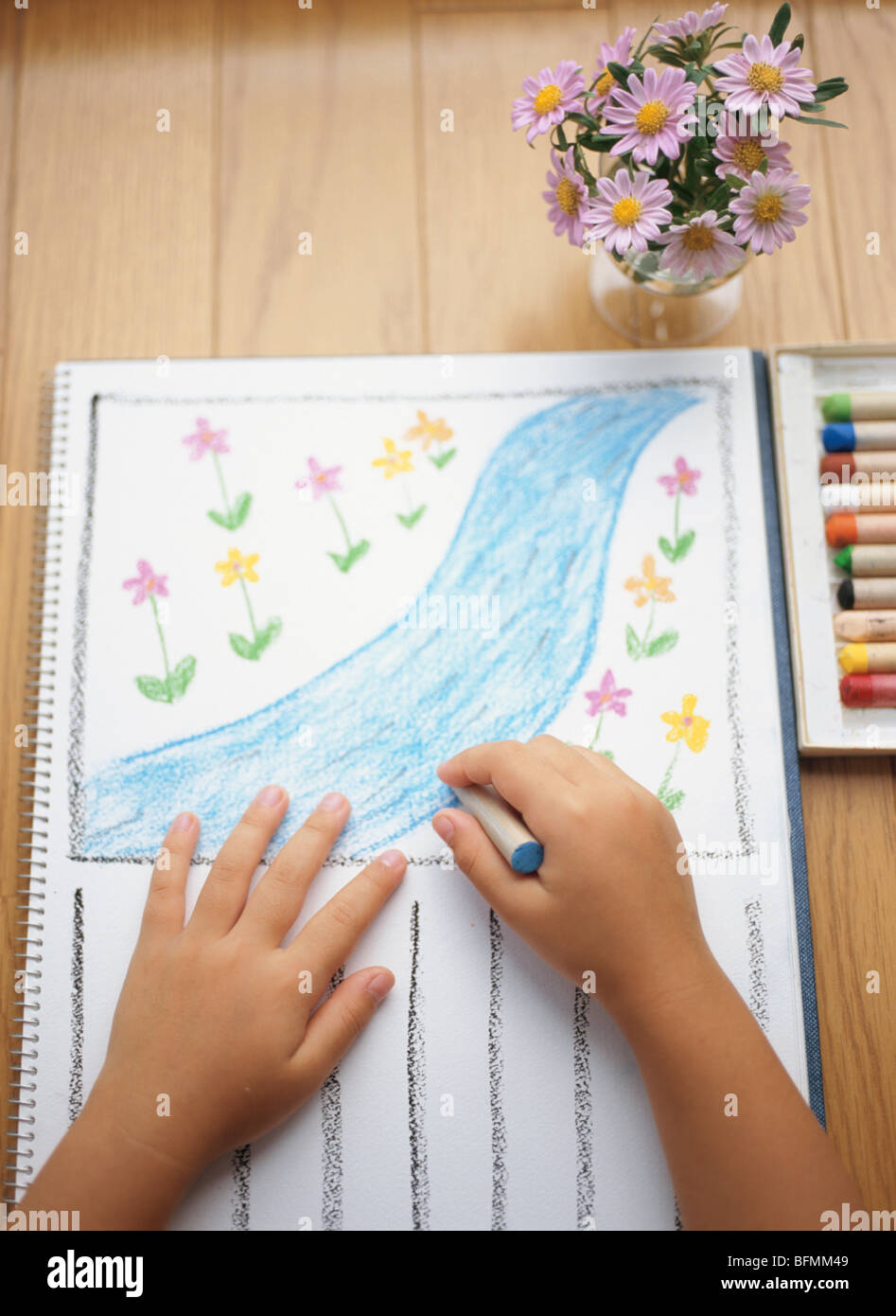 Child drawing on paper Stock Photo - Alamy