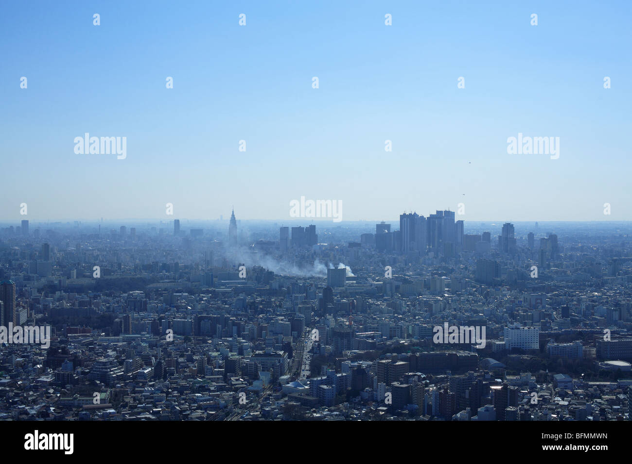 Cityscape of Tokyo, smoke coming up from buildings, Tokyo prefecture ...