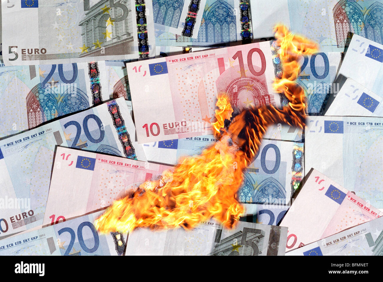 Burning money, conceptual image Stock Photo - Alamy