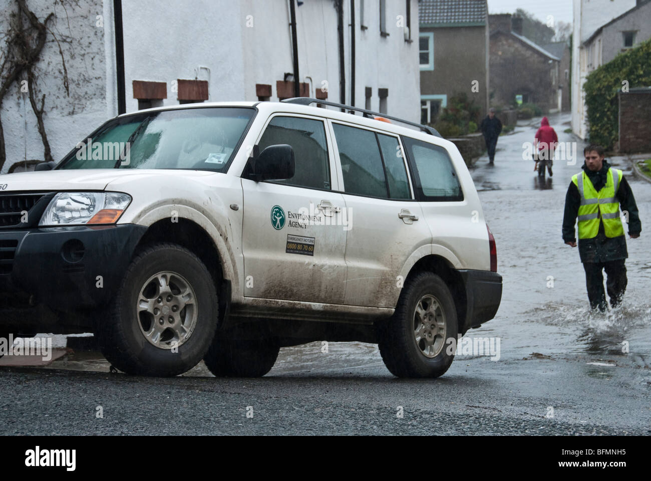 Environment Agency staff and vehicle at floods at Eamont Bridge ...