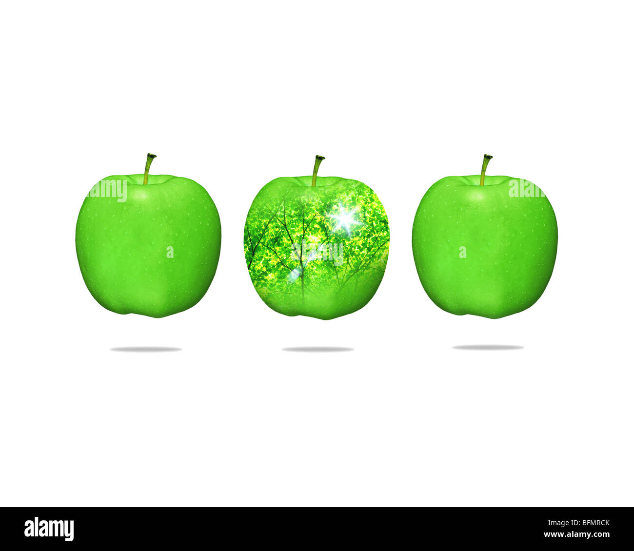 Three apples and one of them with leaves inside Stock Photo - Alamy