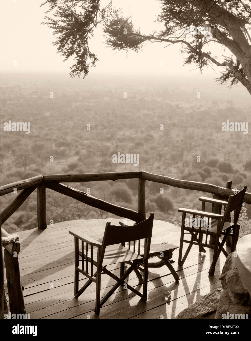 Kenya, Meru National Park. Chairs set out on a deck overlooking the ...
