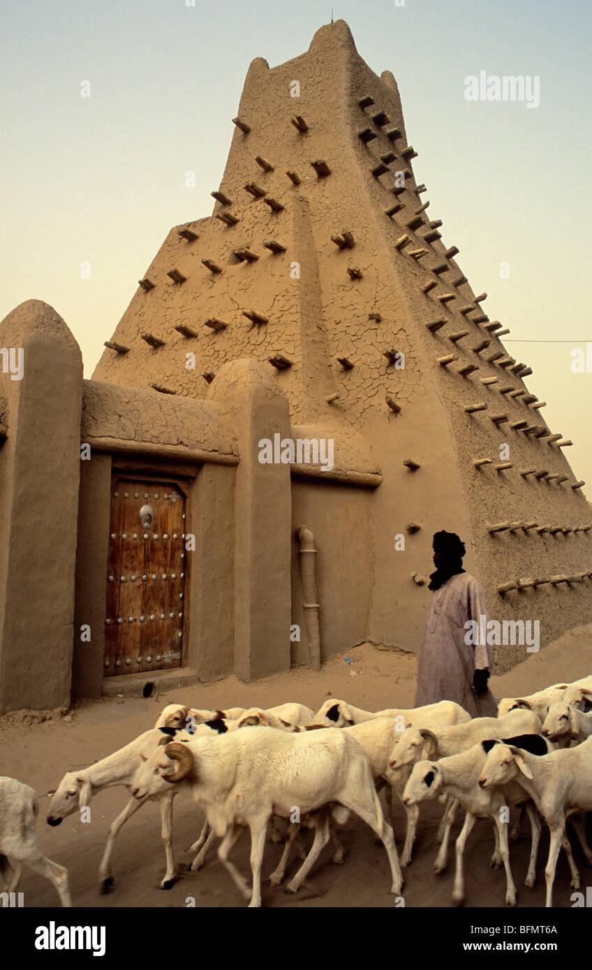 Mali, Timbuktu or Tombouctou. A man strolls past the town's 15th ...