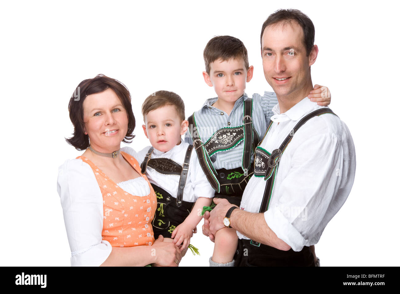 Full isolated studio picture from parents holding their two sons Stock ...