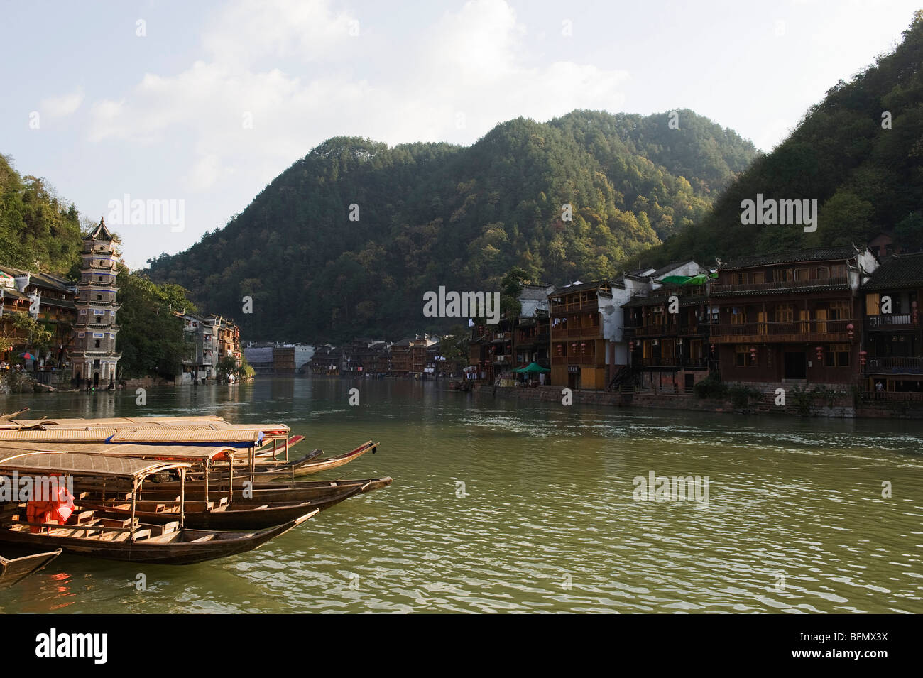 China, Hunan Province, Fenghuang, riverside houses and pagoda Stock ...