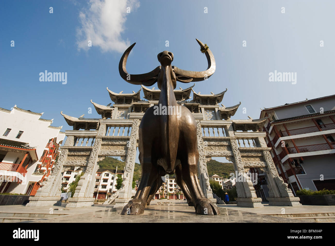 China, Hunan Province, Fenghuang, buffalo statue and Chinese gate Stock ...