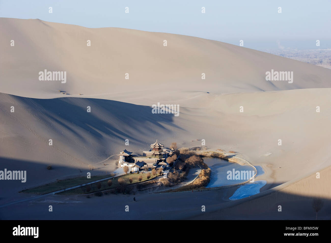 China, Gansu Province, Dunghuang, Ming Sha sand dunes and pavilion at ...
