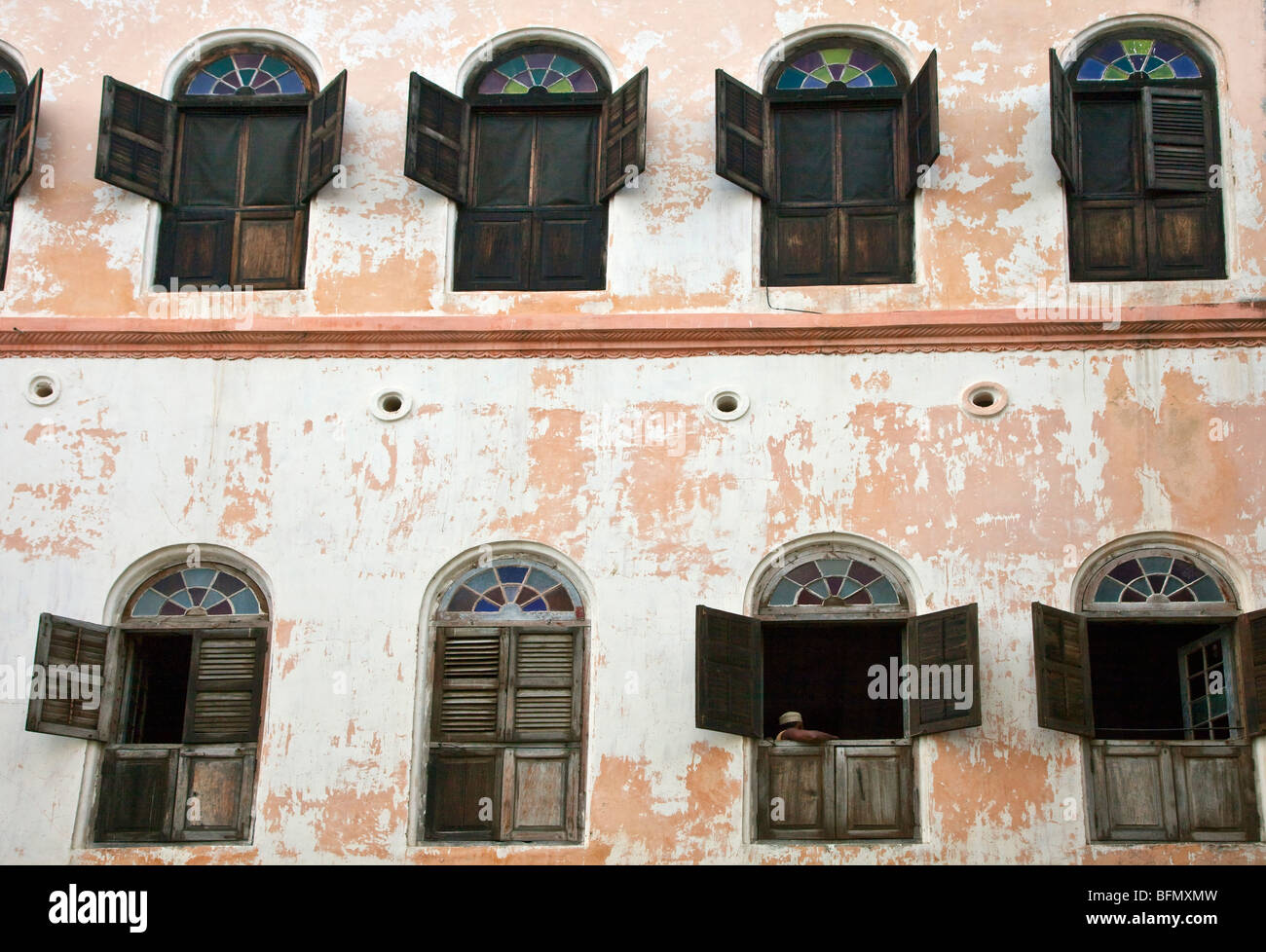 Tanzania, Zanzibar, Stone Town. The shuttered windows of a large old ...