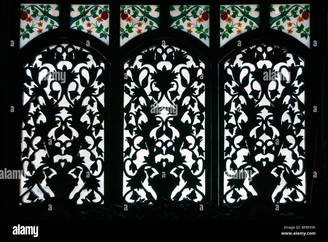 Tanzania, Zanzibar, Stone Town. An ornate window with stained glass at ...