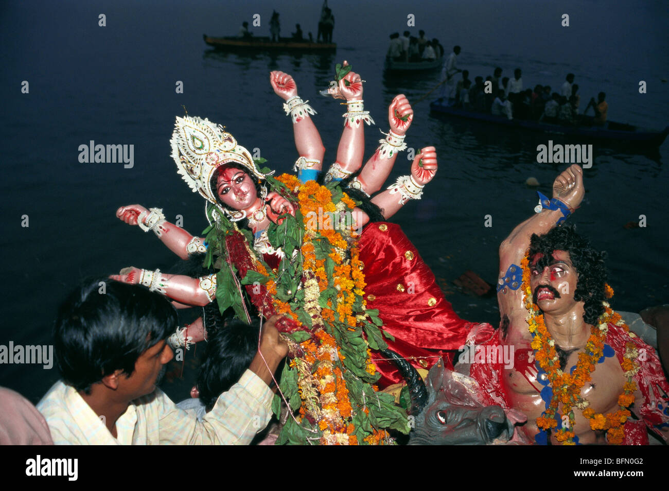Durga Puja ; immersion of Goddess idol in Yamuna river ; Delhi ; India ...