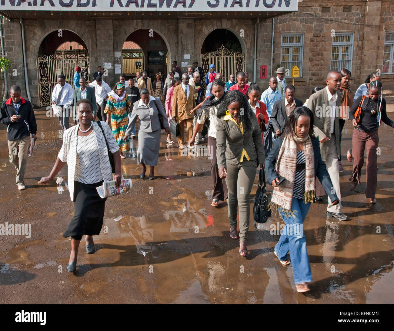 Kenya, Nairobi. Commuters walk to work from Nairobi Railway Station ...