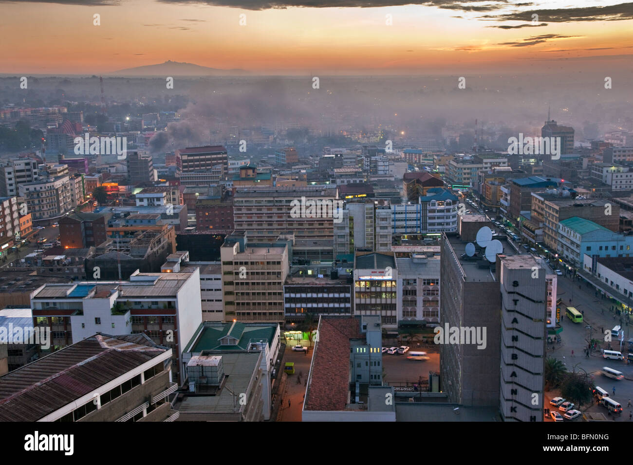 Kenya, Nairobi. Nairobi at daybreak with Mount Kenya rising in the far ...