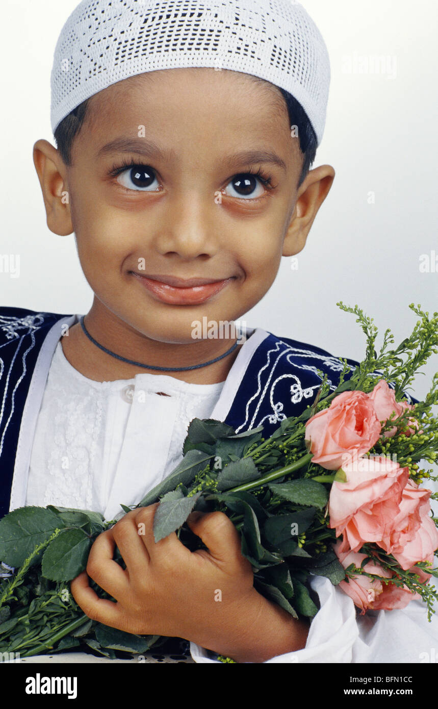 Muslim child holding flower bouquet - MR#152 Stock Photo - Alamy