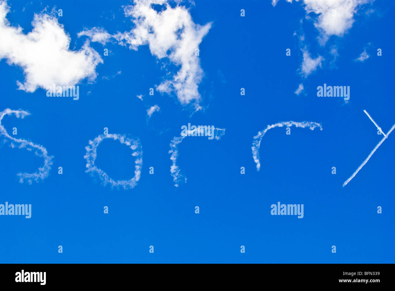 A plane sign writer paints sorry into a clear blue sky with smoke Stock ...