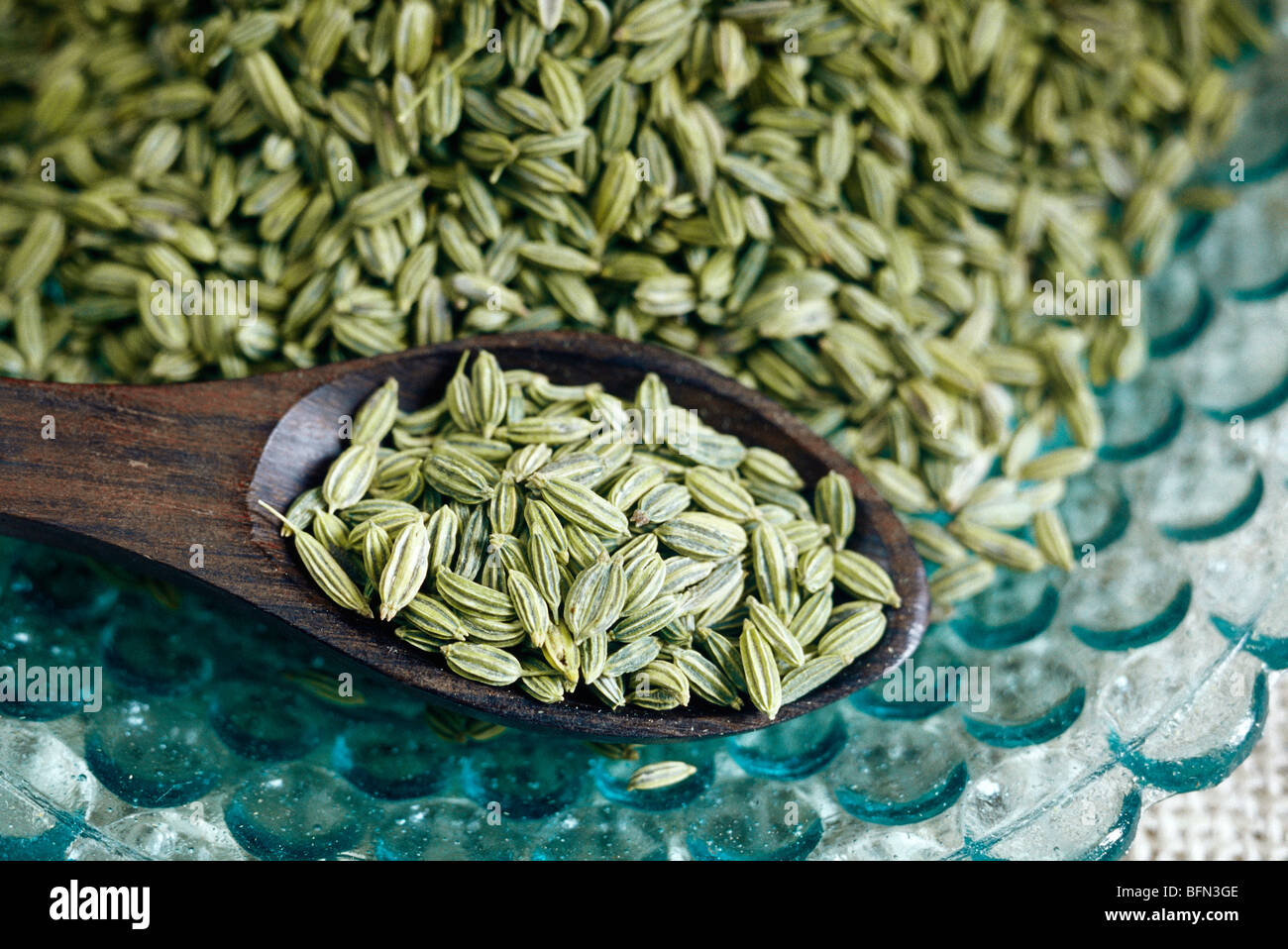 fennel seeds in wooden spoon Stock Photo - Alamy