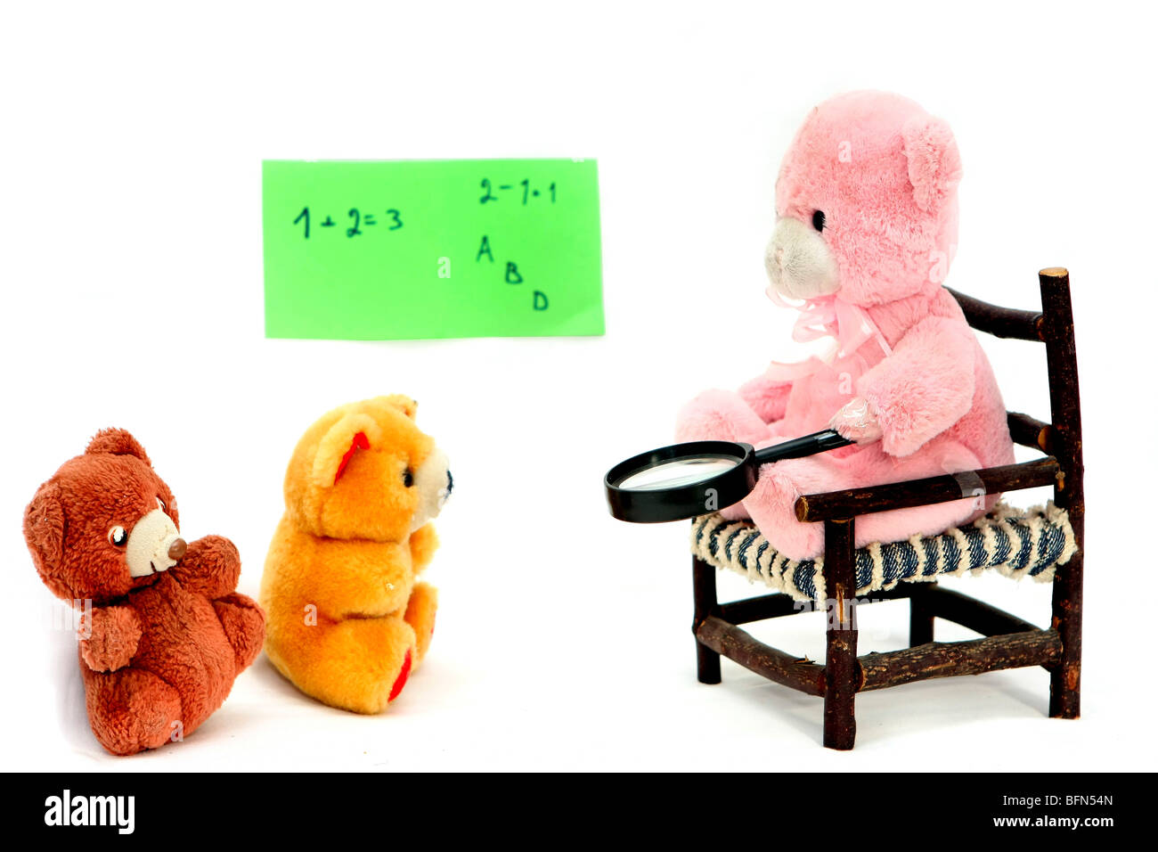 Teddy Bear in a class room environment teaches two smaller teddy bear ...