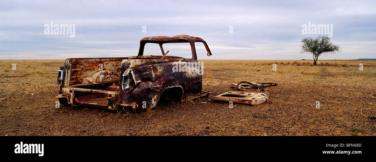 The wreck of an antique car rusting away on a drought-stricken farm ...