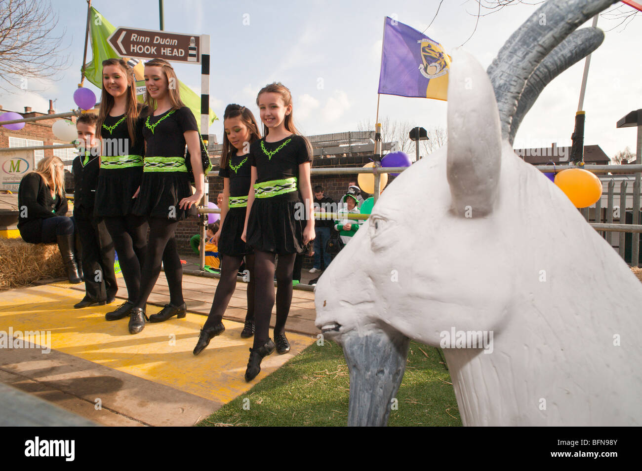 Goat and young girl dancers on Kennedy Homestead float in Brent St ...