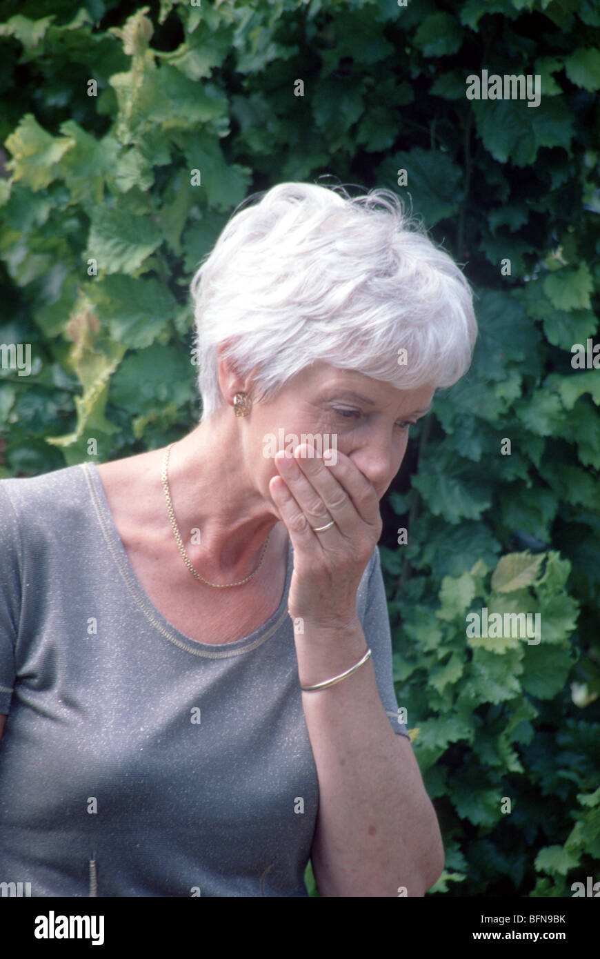 Senior woman shamefaced Stock Photo - Alamy
