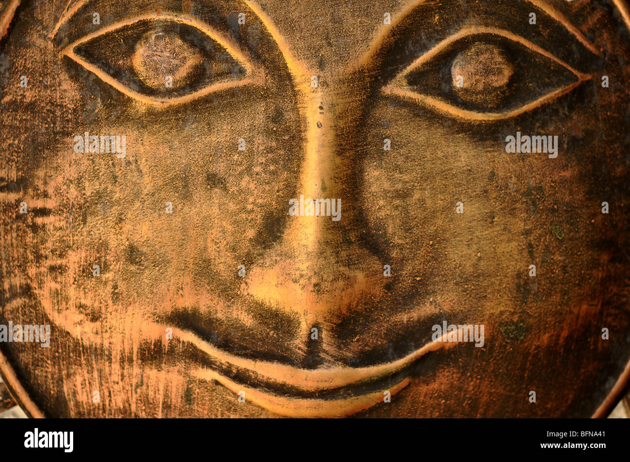 The Face of a Copper decoration on a house Stock Photo - Alamy