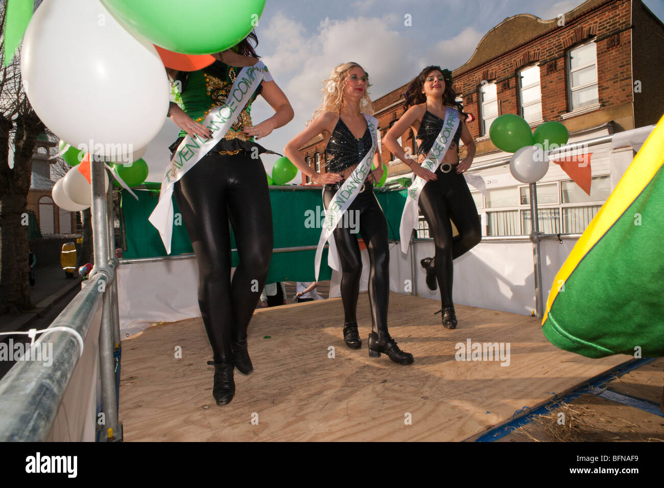 YOung women dancing on float in Brent St Patrick's Day Parade Stock ...