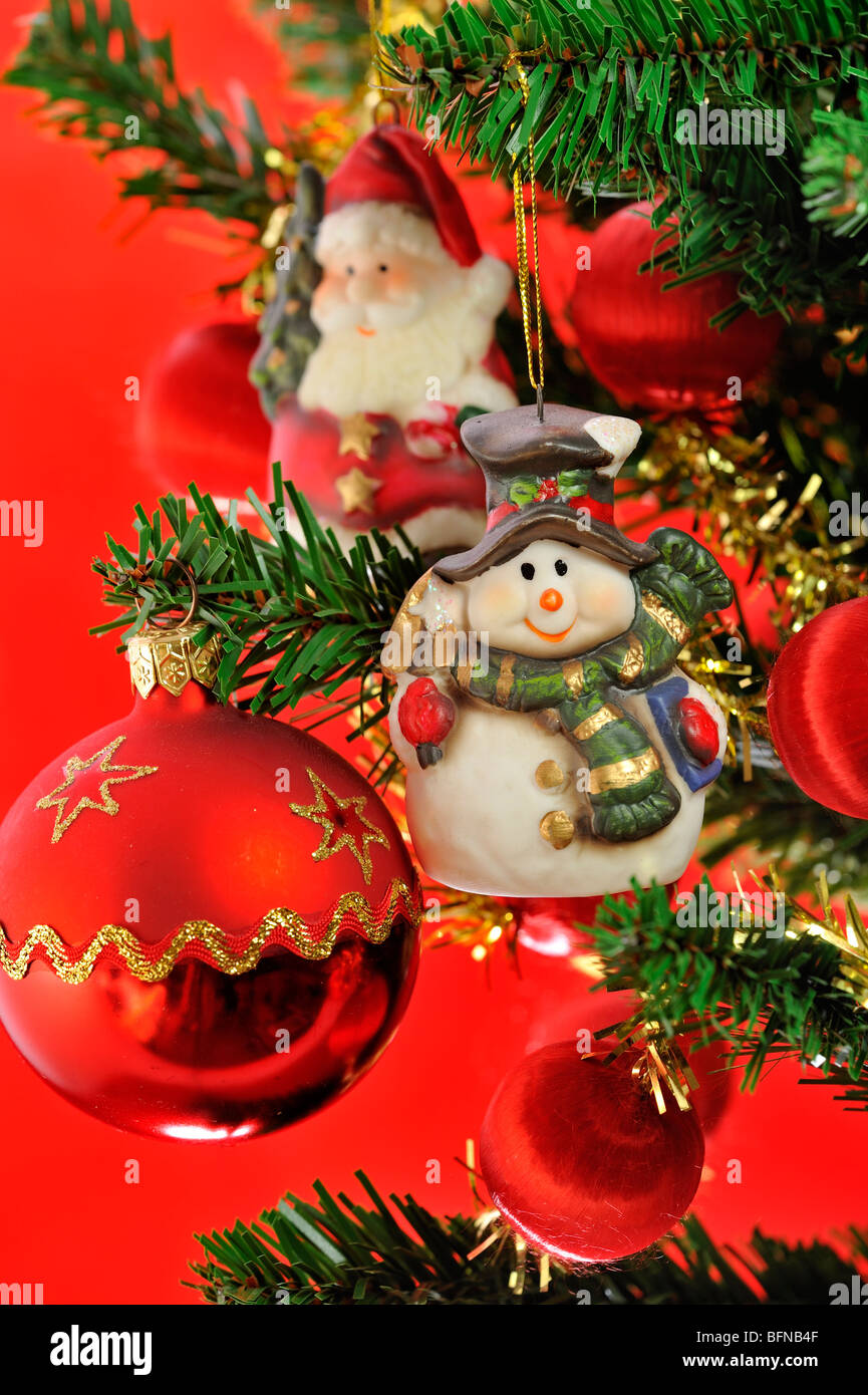 Snowman, Father Christmas / Santa Claus and bells hanging in tree Stock ...