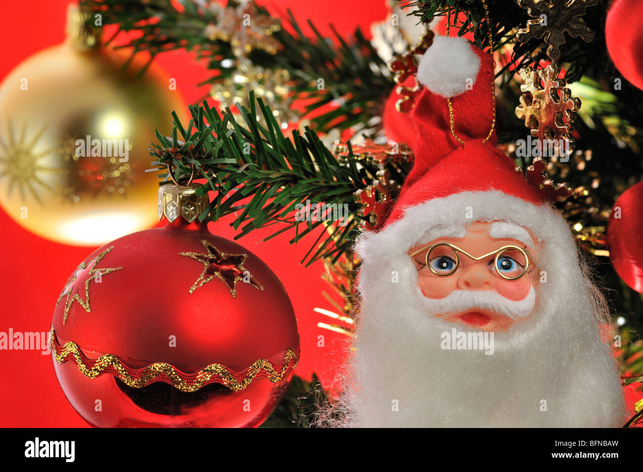 Santa Claus / Father Christmas and bells hanging in tree Stock Photo ...